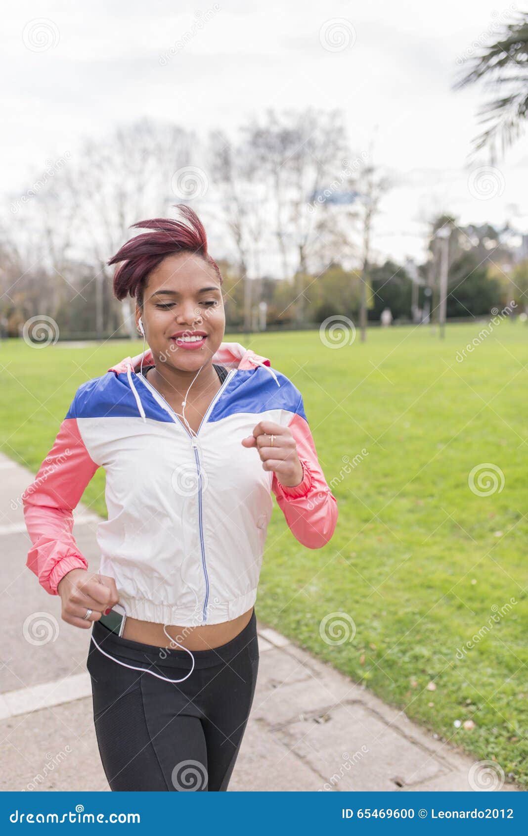 Smiling woman running . stock photo. Image of jogging - 65469600