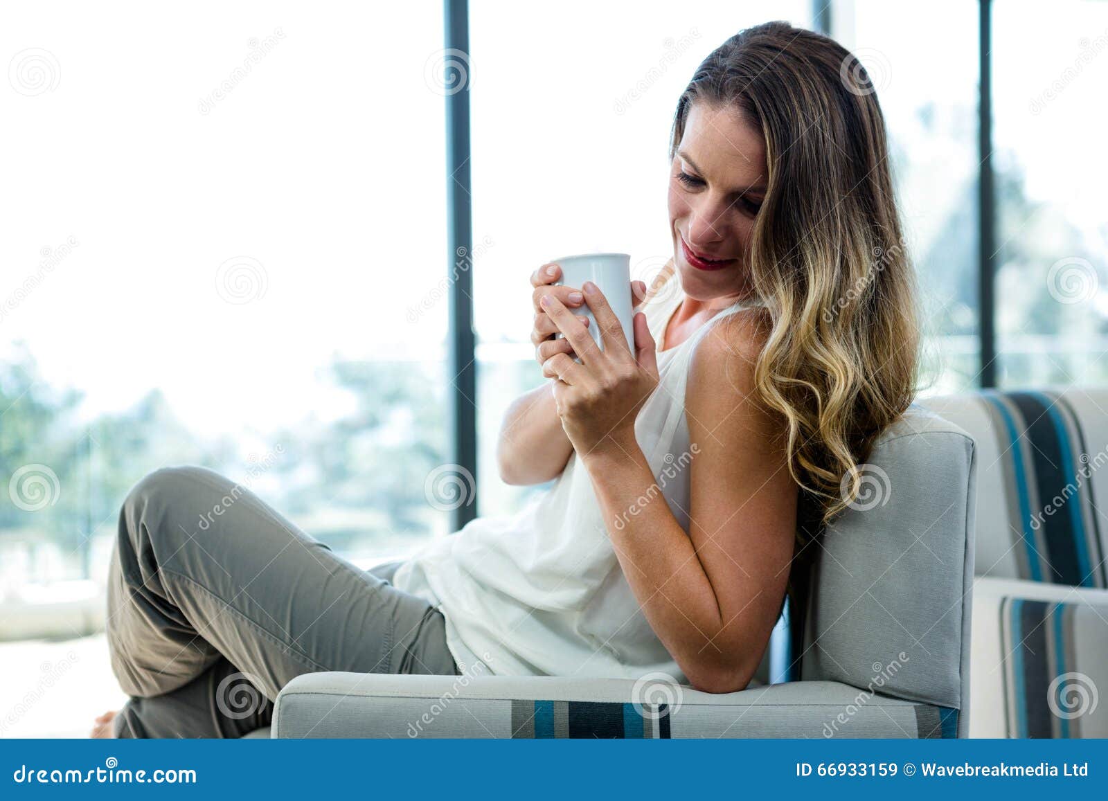 Smiling Woman Sipping a Cup of Coffee Stock Image - Image of drinking ...