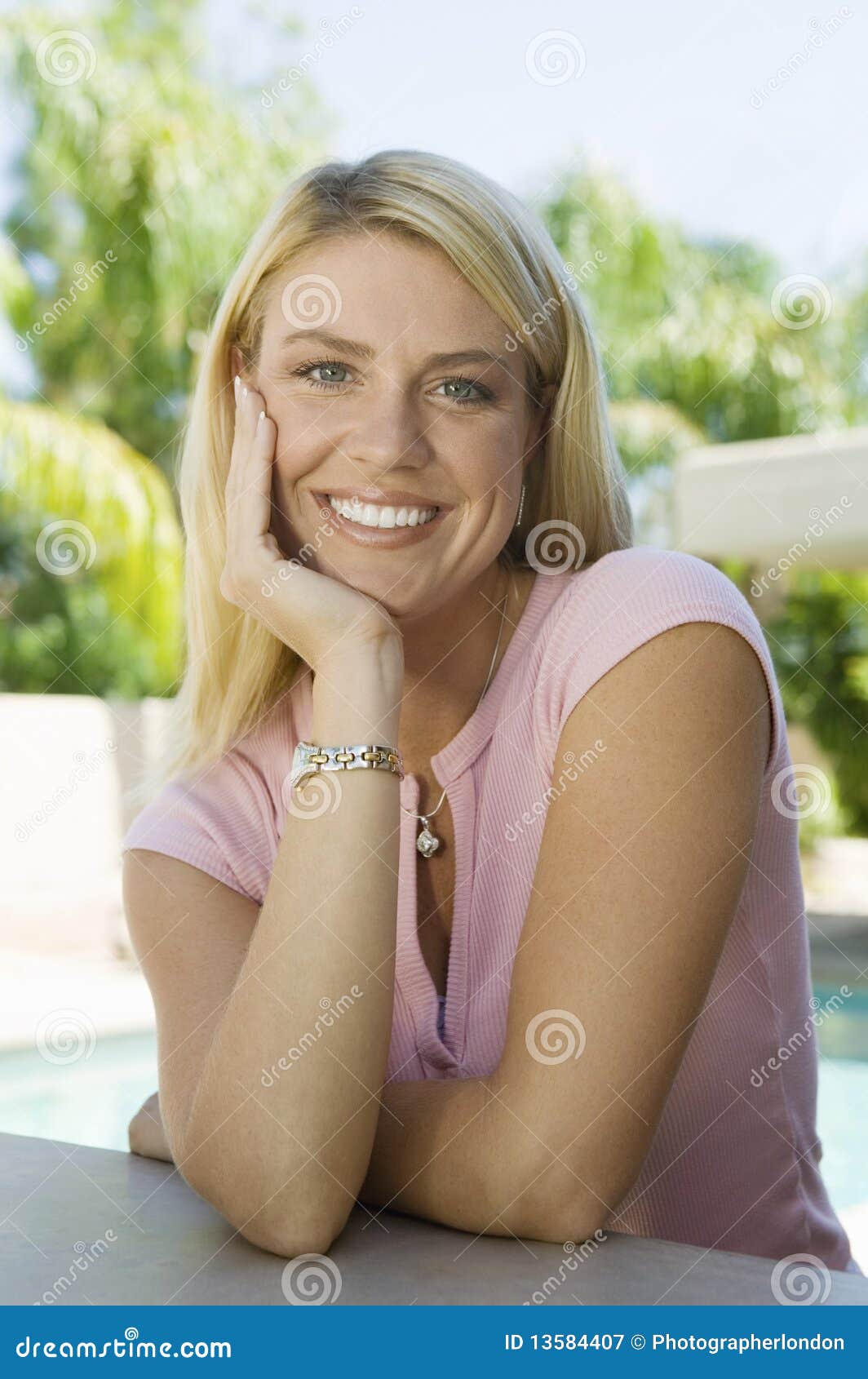 Smiling Woman Sitting on Poolside Stock Image - Image of people ...