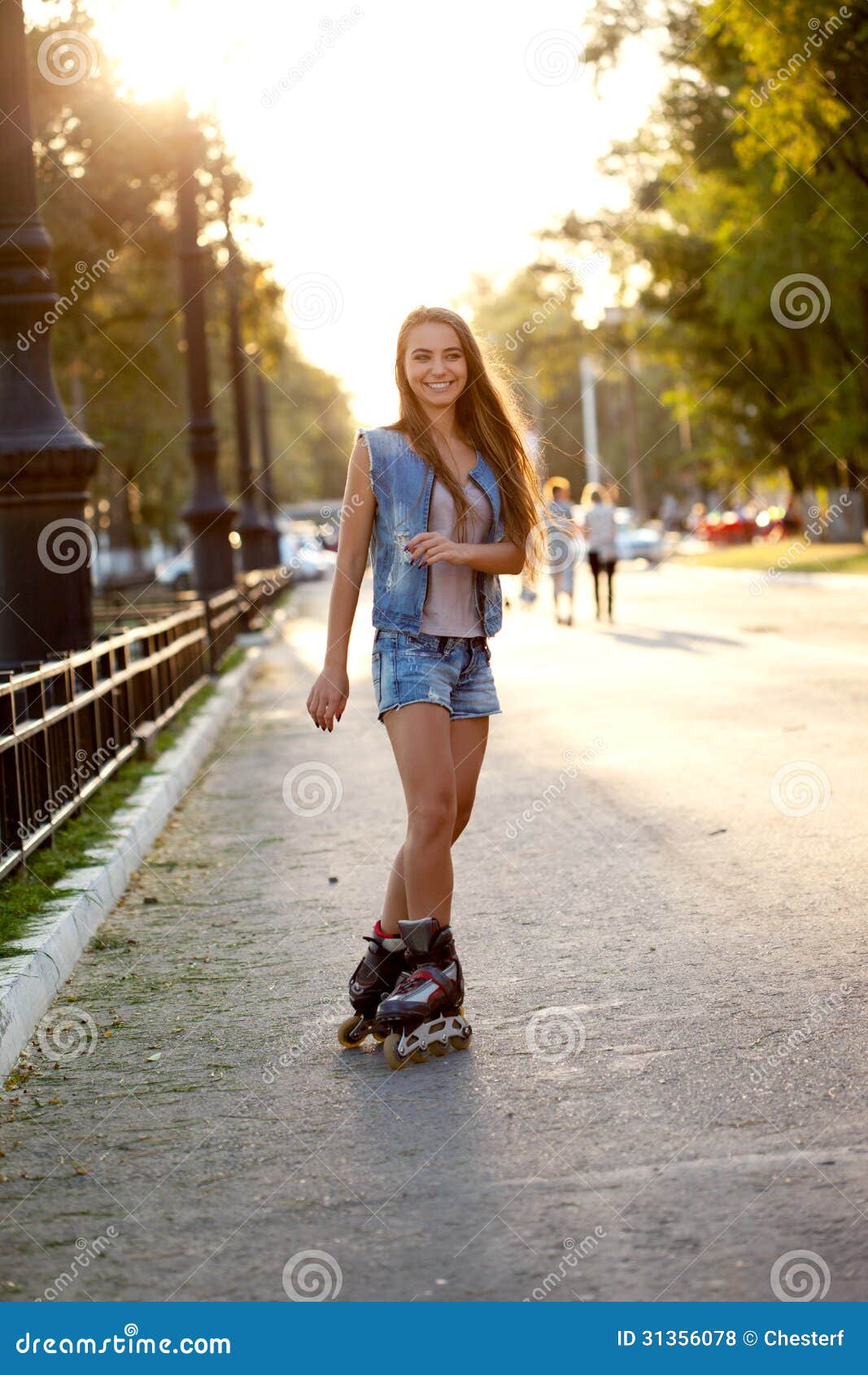 Smiling Woman Skating during Sunset Stock Photo - Image of sitanding ...