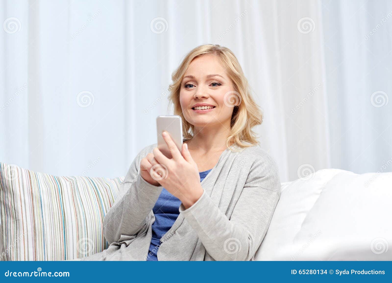 Smiling Woman with Smartphone Texting at Home Stock Photo - Image of ...