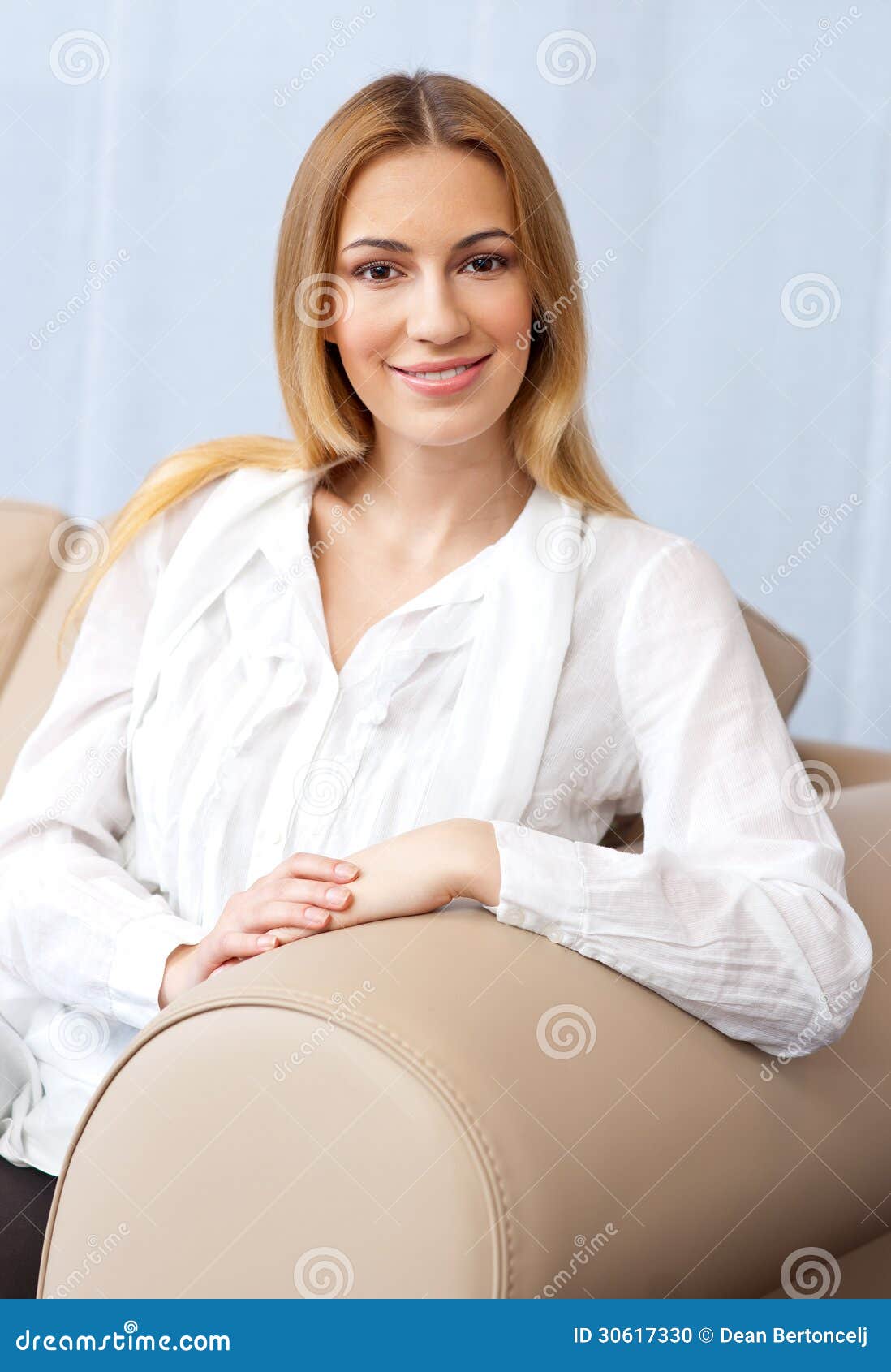 Smiling woman on sofa stock photo. Image of happy, indoors - 30617330