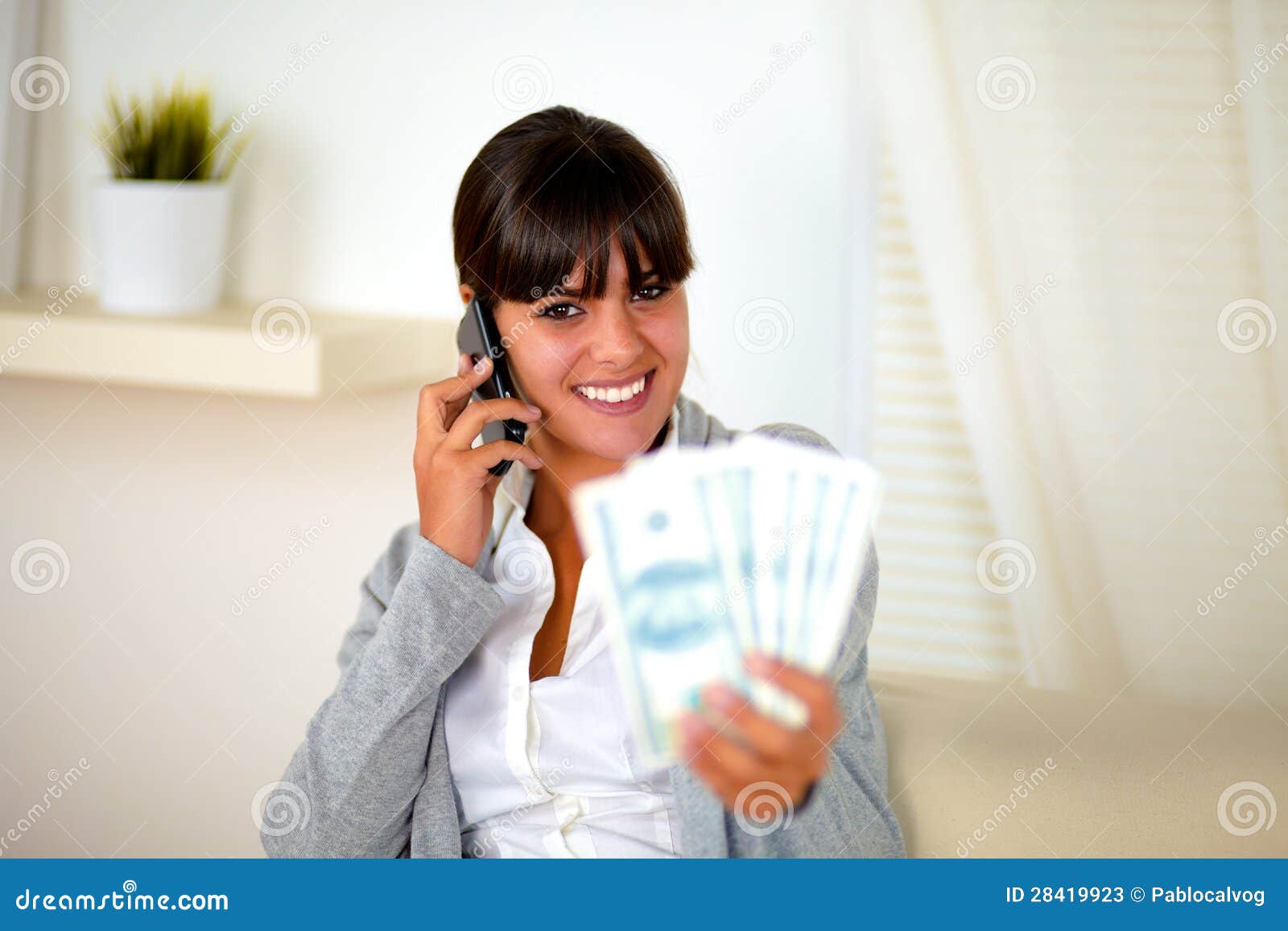 Smiling Woman Speaking on Cellphone with Money Stock Image - Image of ...