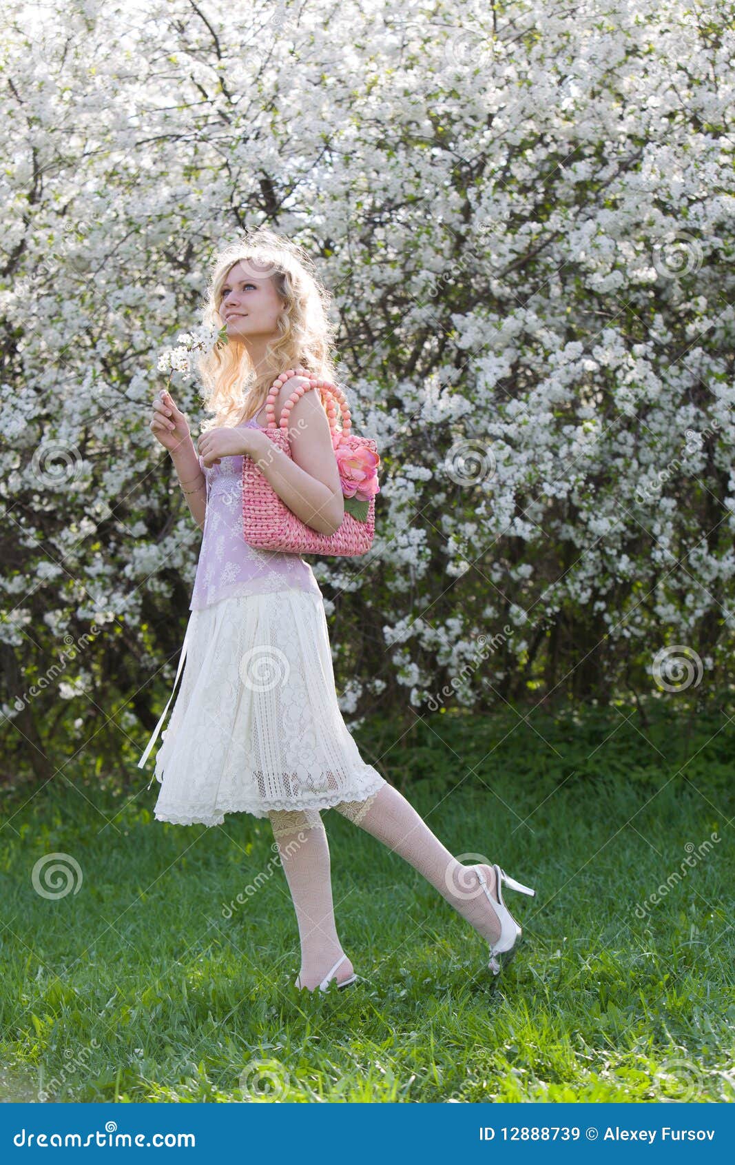 Smiling woman at spring stock image. Image of flowers - 12888739