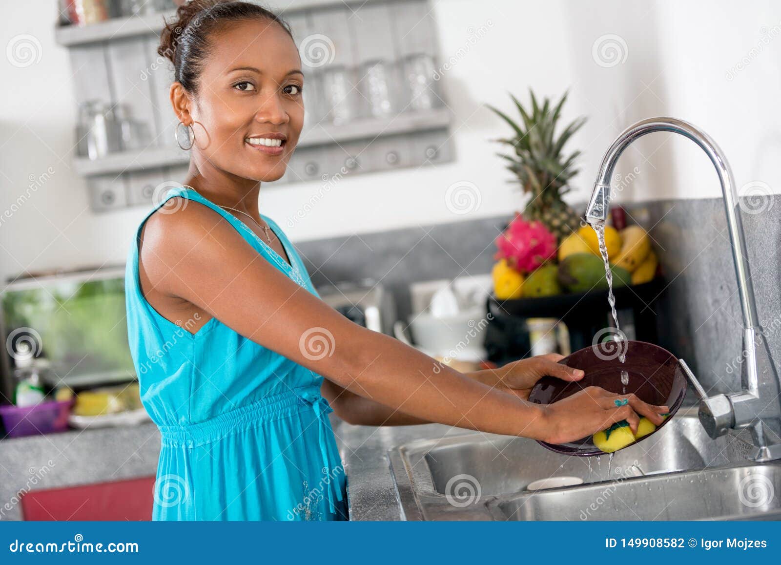 Smiling Woman Standing Front of Kitchen Sink Washing Dishes Stock Photo ... Smiling Woman Standing Front of Kitchen Sink Washing Dishes Stock Photo ...