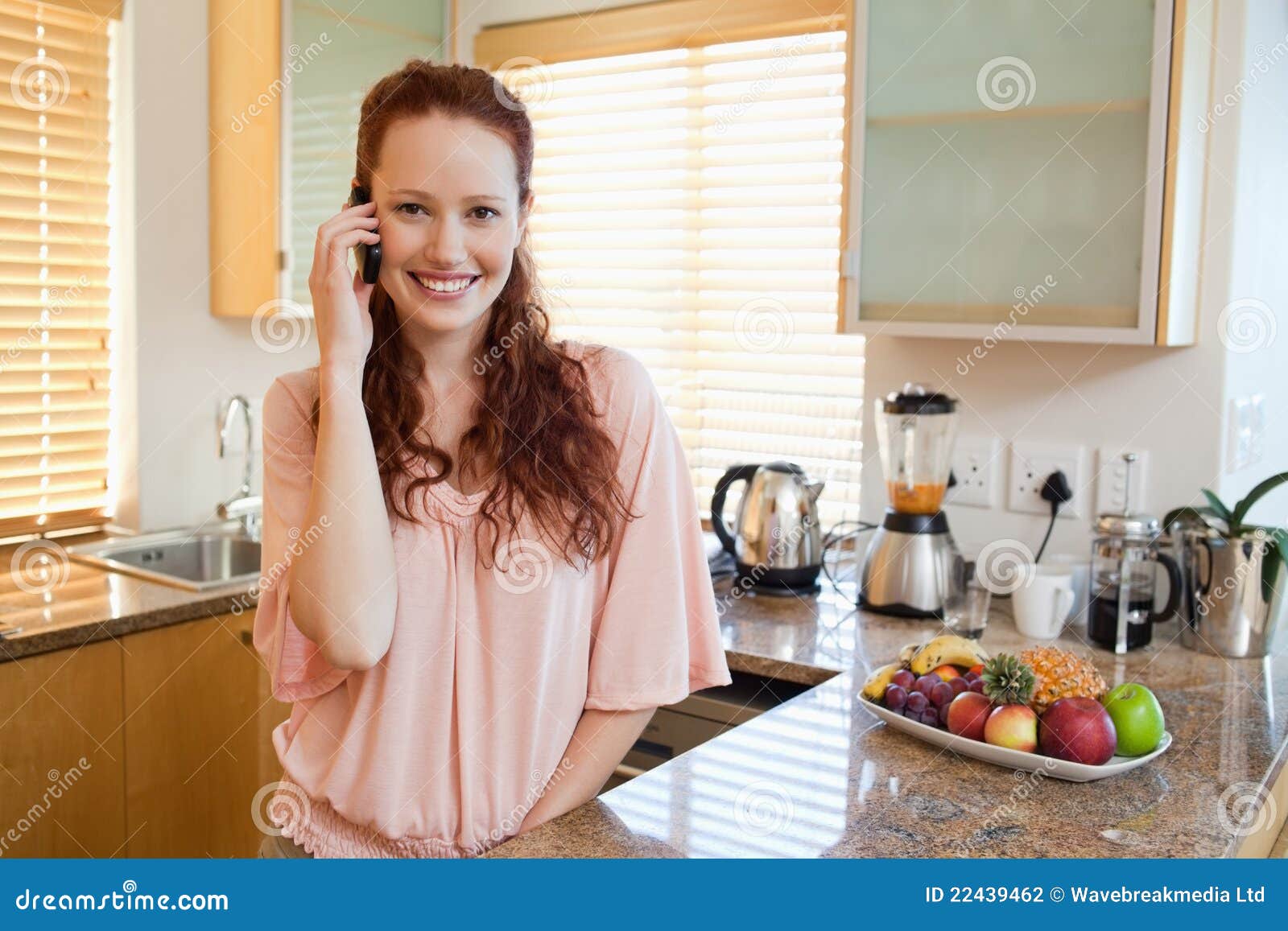 Smiling Woman Talking on the Phone in the Kitchen Stock Photo - Image ...