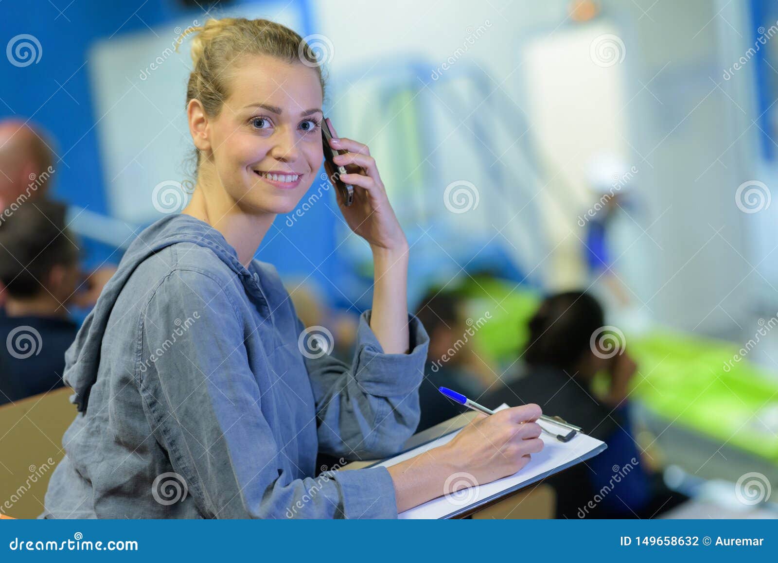 Smiling Woman Talking on Phone and Writing Notes Stock Photo - Image of ...