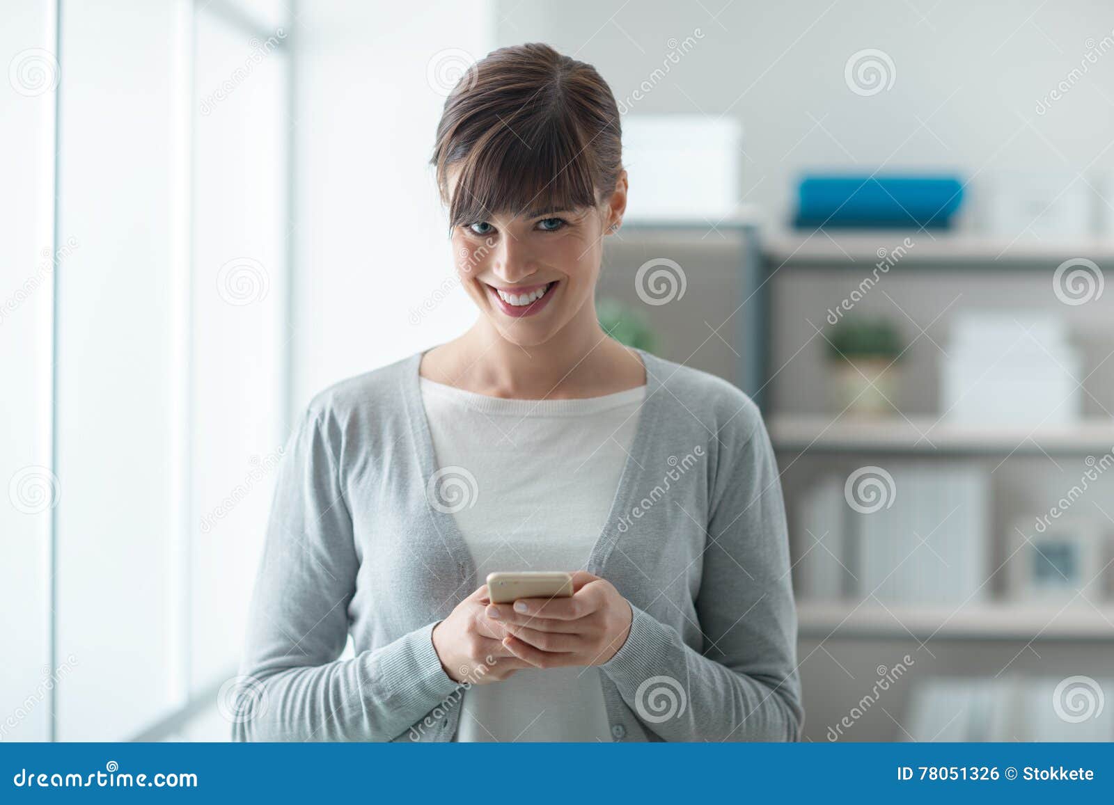 Smiling Woman Texting with Her Mobile Stock Photo - Image of indoors ...