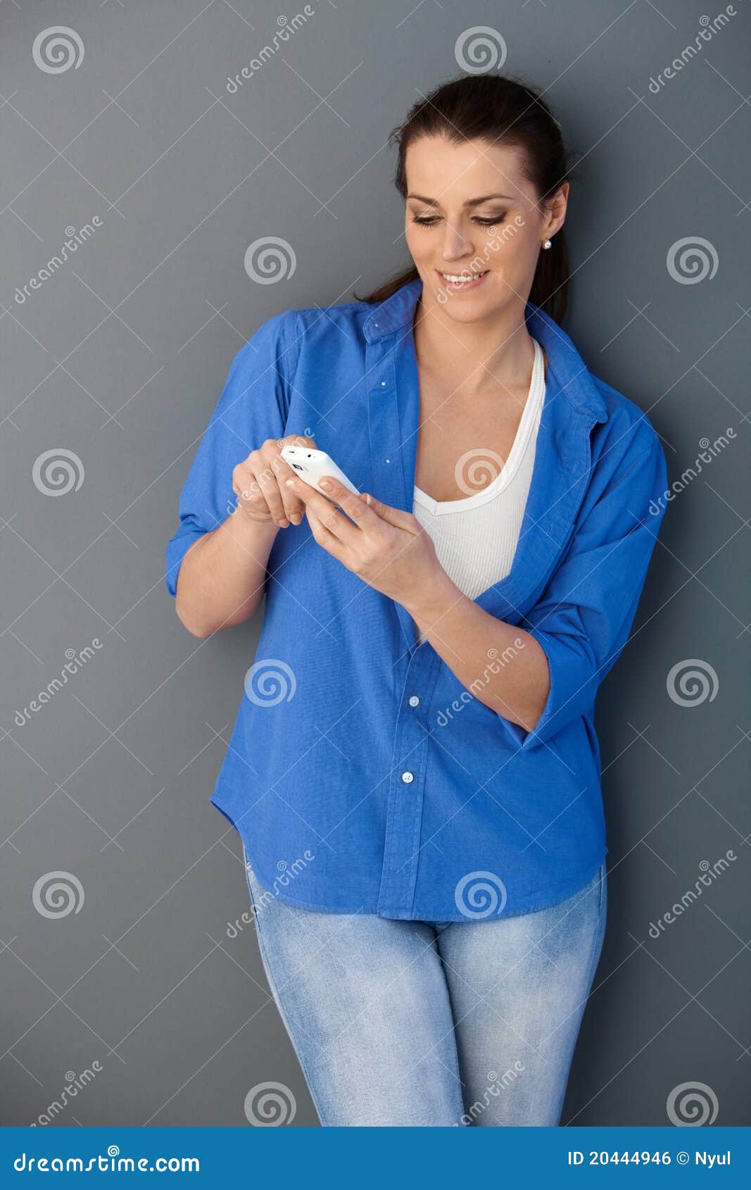 Smiling Woman Texting on Mobile Phone Stock Photo - Image of clothing ...