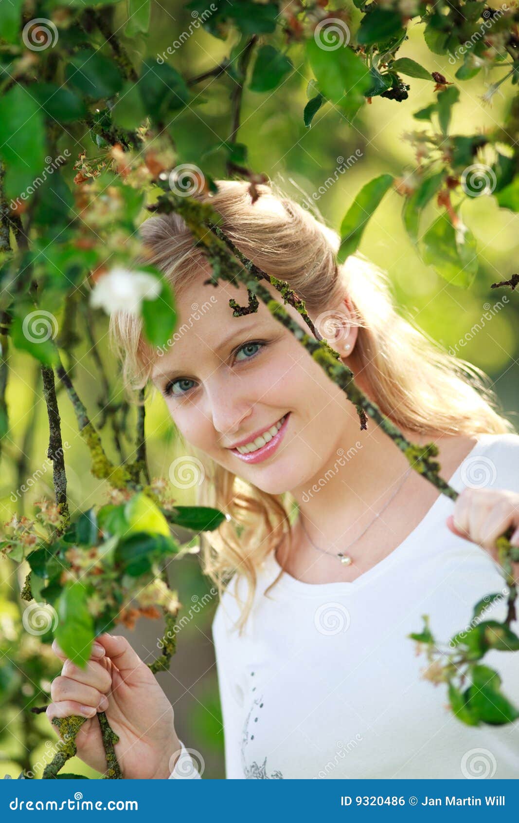 Smiling Woman through Tree stock photo. Image of beauty - 9320486