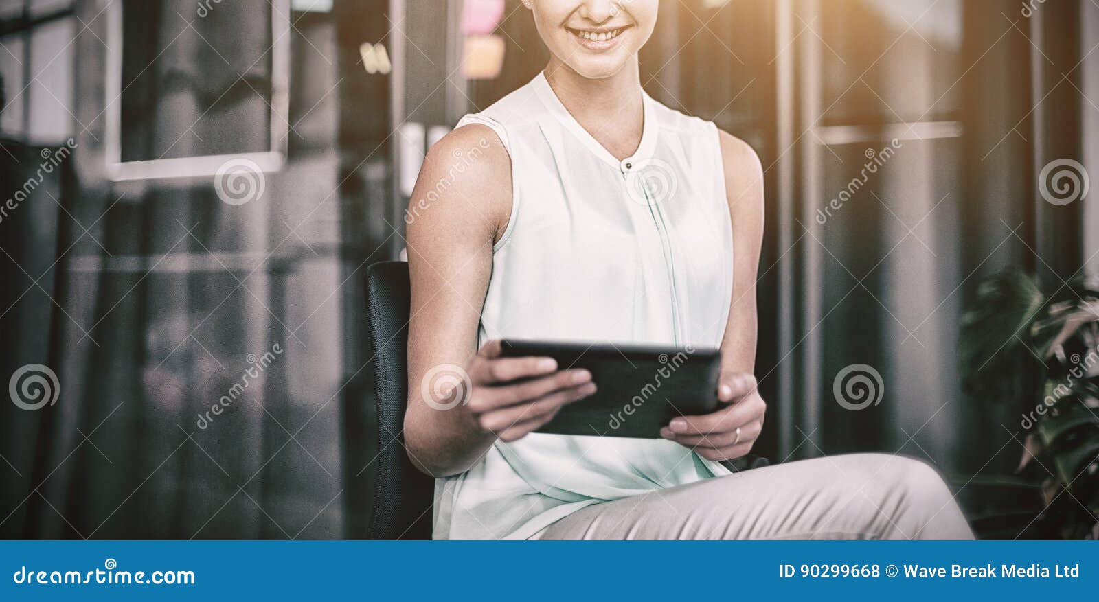 Smiling Woman Using Digital Tablet in Office Stock Photo - Image of ...