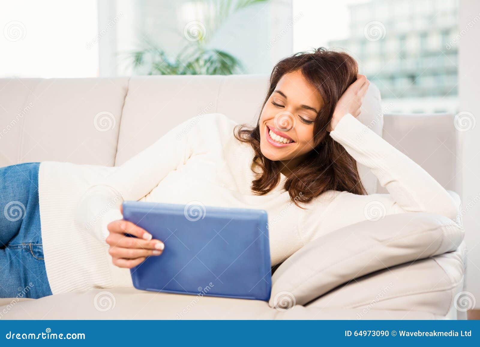 Smiling Woman Using Her Tablet on Couch Stock Photo - Image of pretty ...