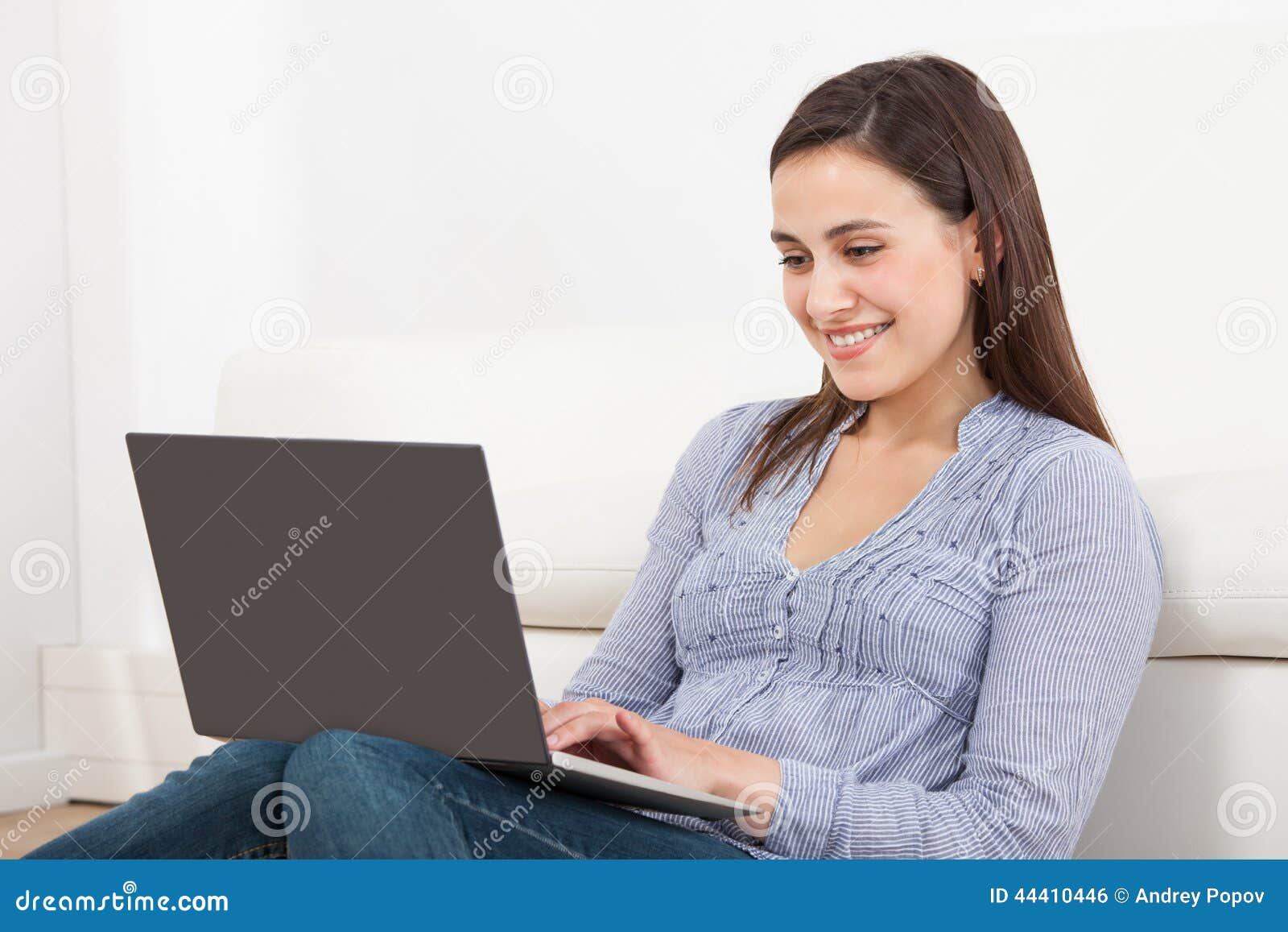 Smiling Woman Using Laptop in House Stock Photo - Image of sitting ...