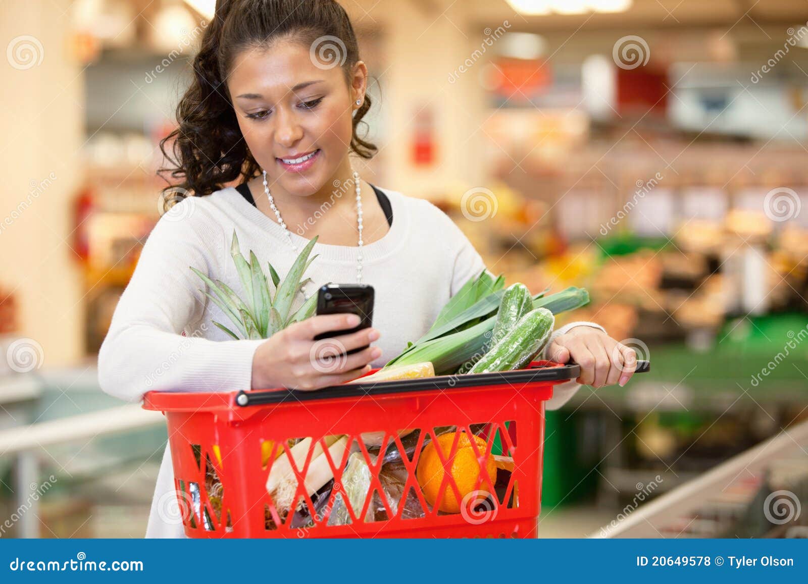 Smiling Woman Using Mobile Phone in Shopping Store Stock Photo - Image ...