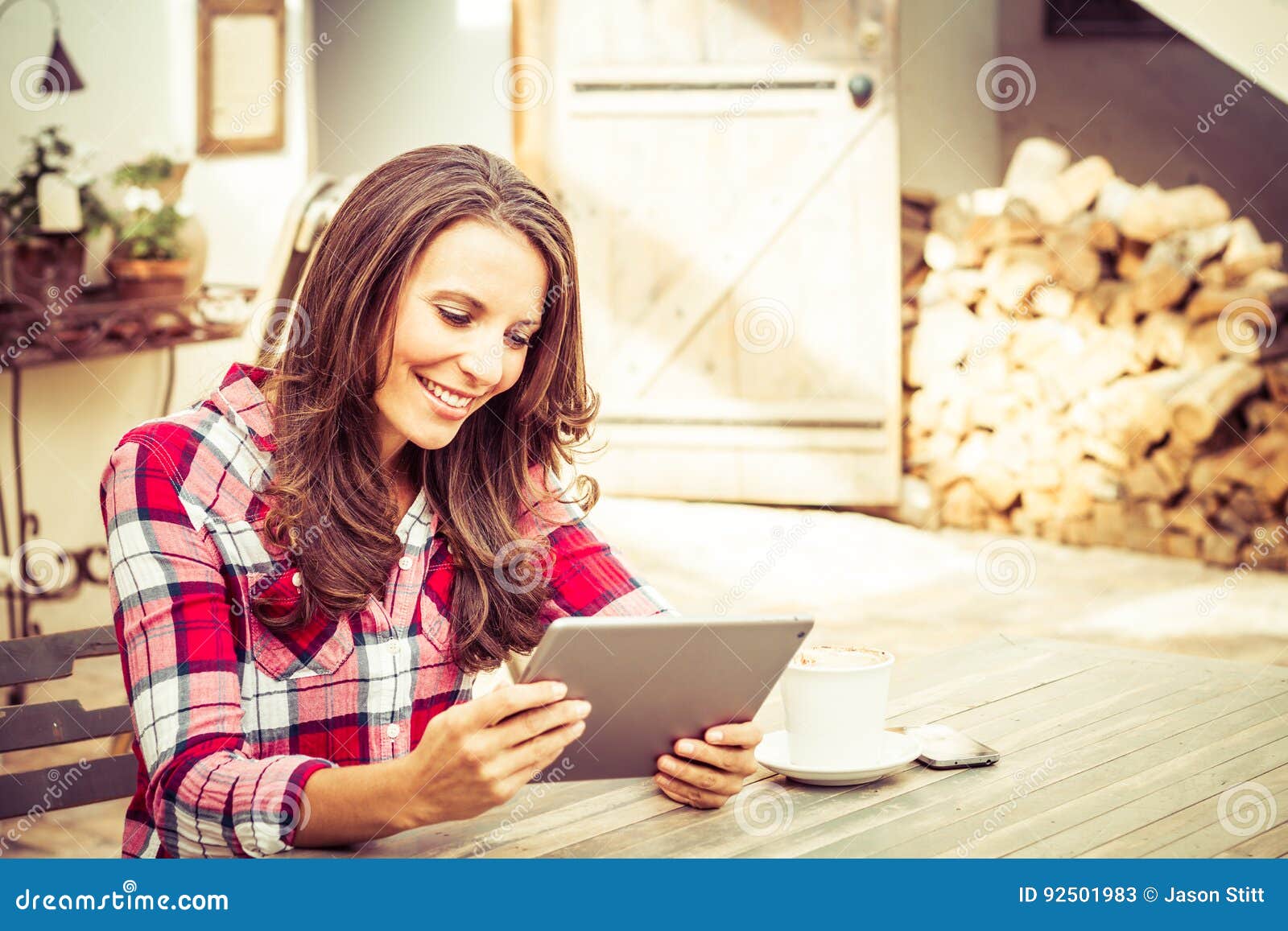 Smiling Woman Using Tablet stock image. Image of phone - 92501983