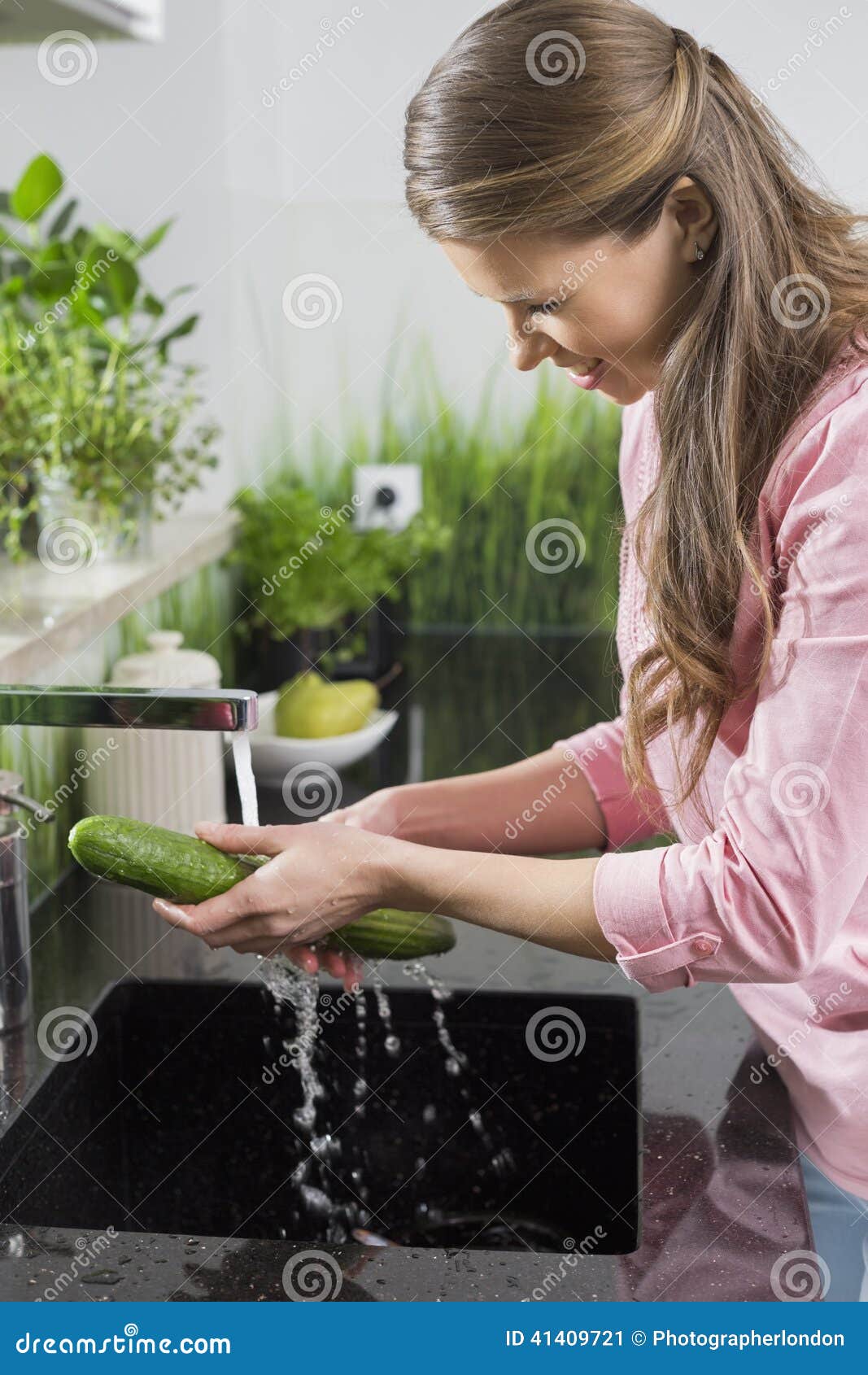 Smiling Woman Washing Cucumber in Kitchen Stock Image - Image of casual ...