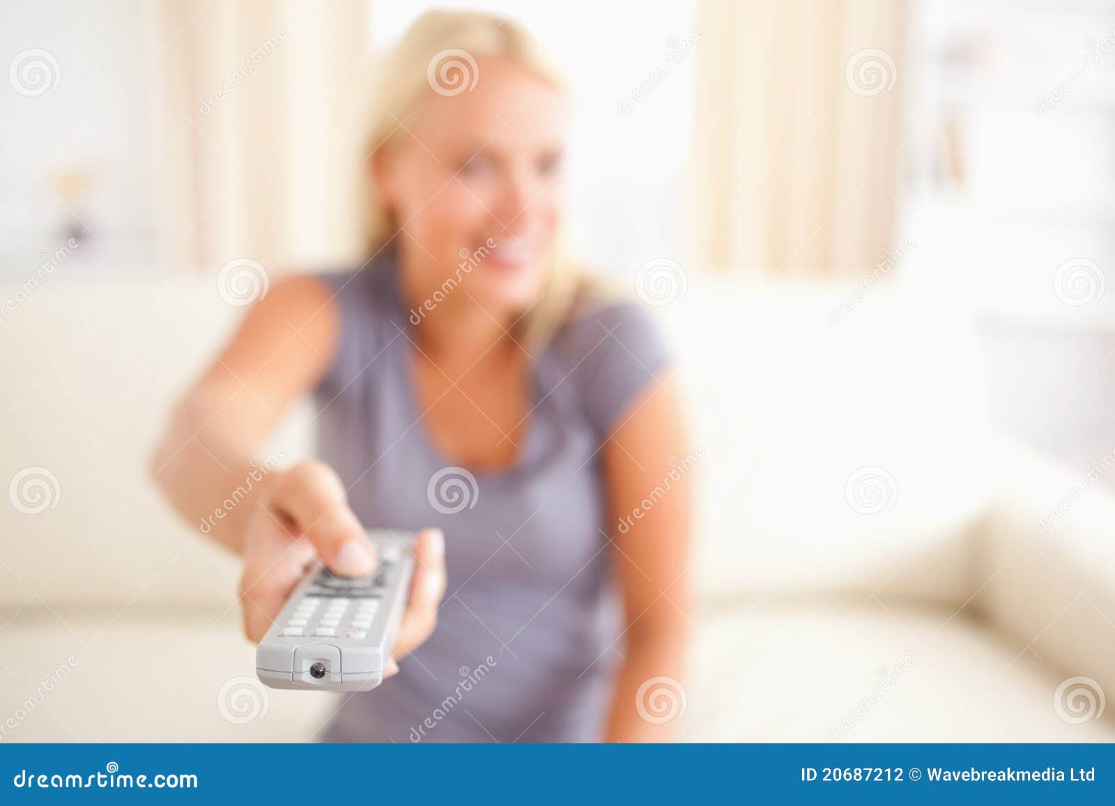 Smiling woman watching TV stock photo. Image of posing - 20687212