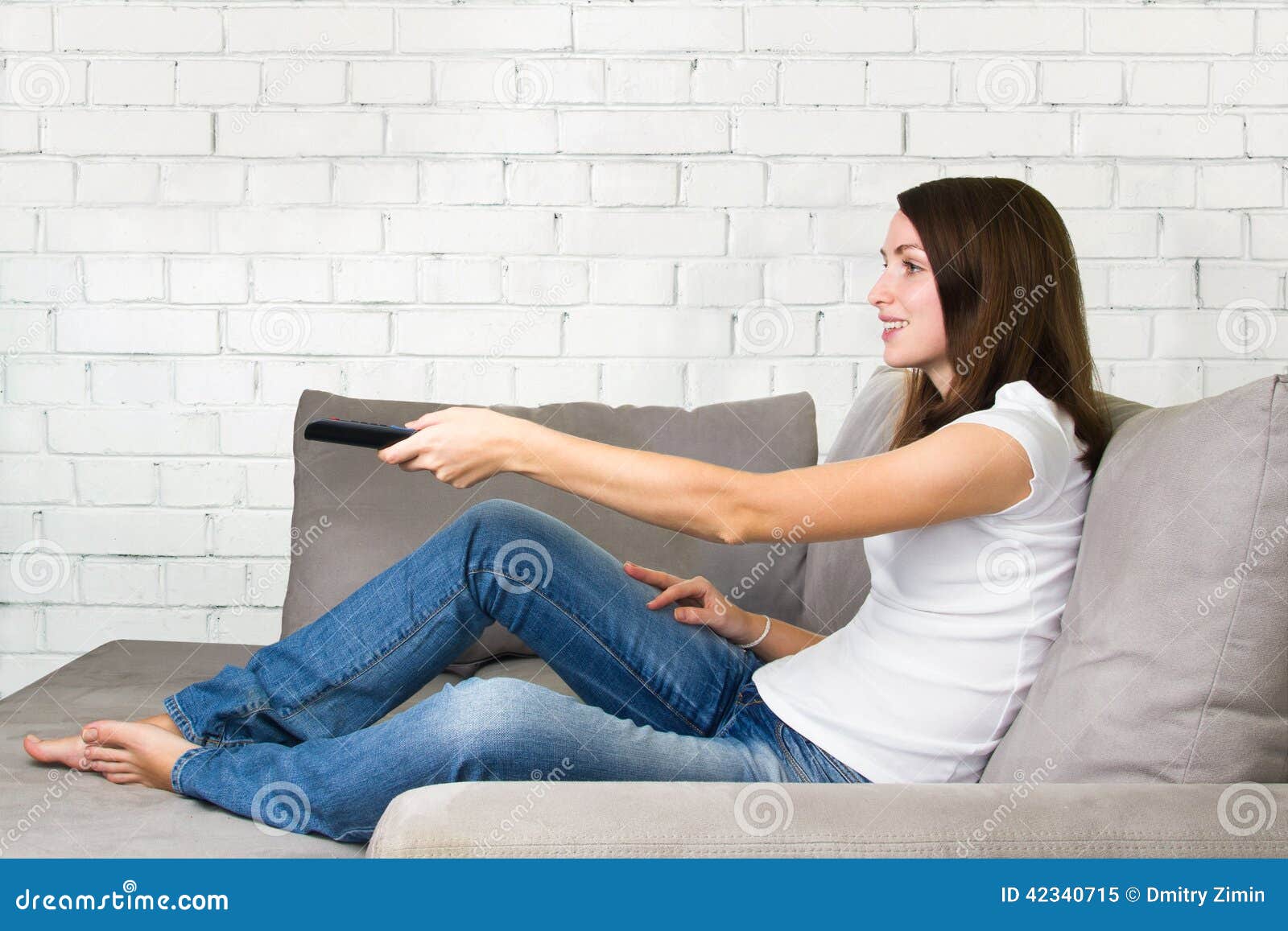 Smiling woman watching TV stock image. Image of girl - 42340715