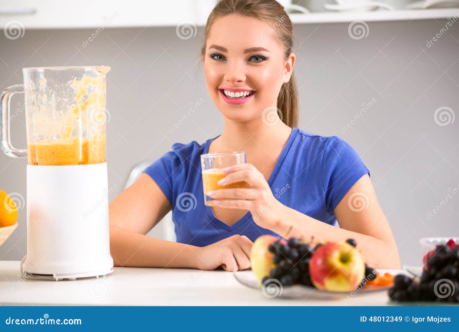 Smiling woman wit blender stock image. Image of natural - 48012349