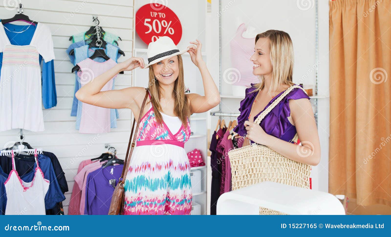 Smiling Women Choosing Clothes Together Stock Image - Image of shop ...