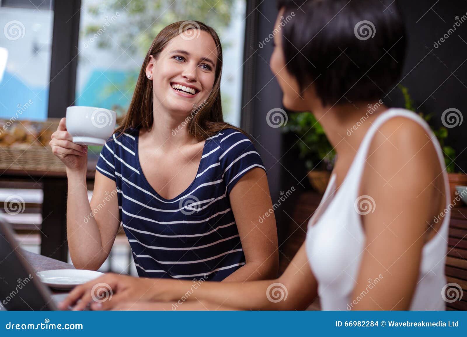 Smiling Women Having Coffee Together Stock Photo - Image of affection ...