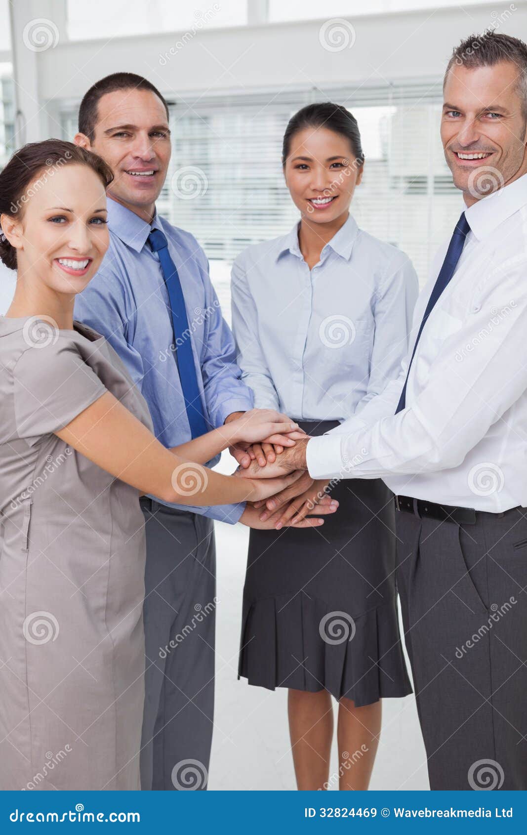Smiling Work Team Joining Hands Together Stock Image - Image of ...
