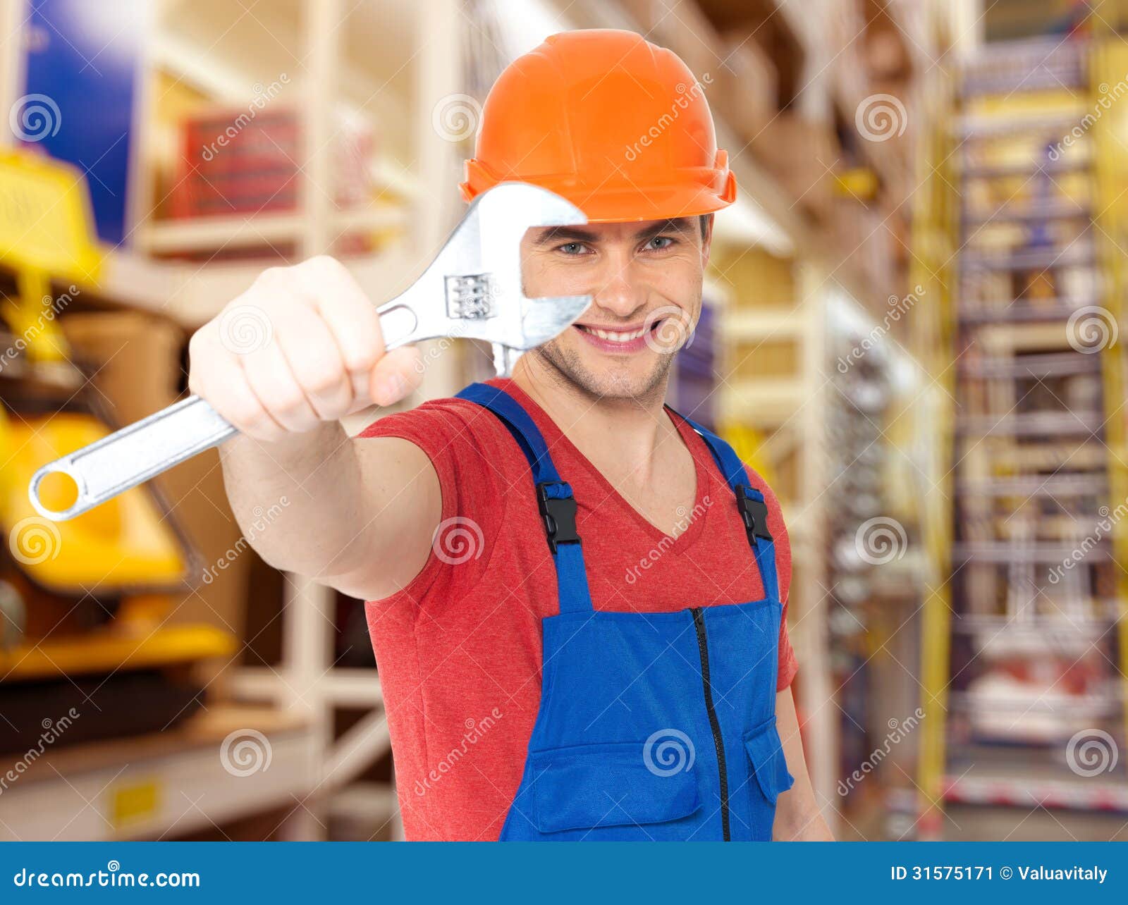 Smiling Worker with Big Spanner Stock Image - Image of caucasian ...