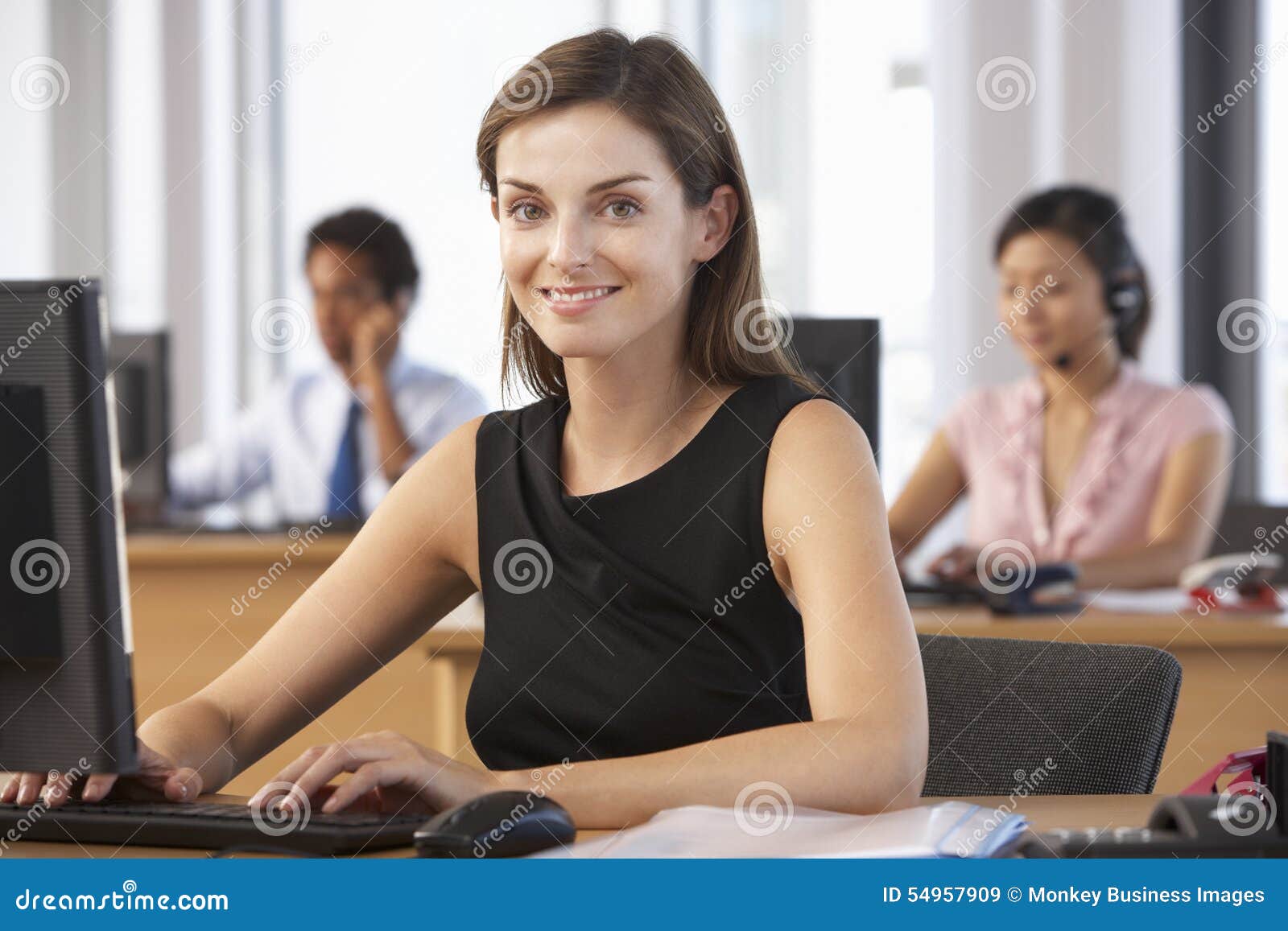 Smiling Worker in Busy Office Stock Image - Image of business, customer ...