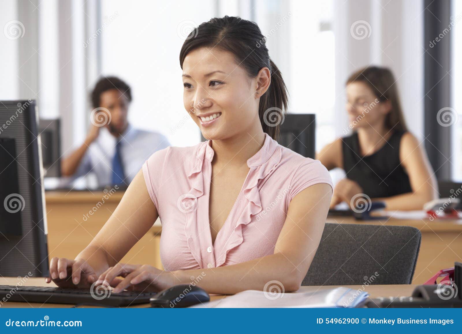 Smiling Worker in Busy Office Stock Photo - Image of friendly ...