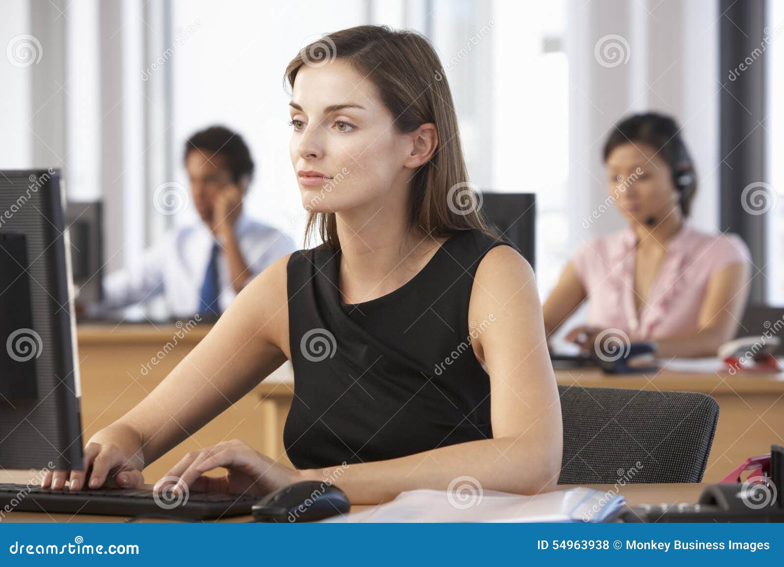 Smiling Worker in Busy Office Stock Photo - Image of teamwork, people ...