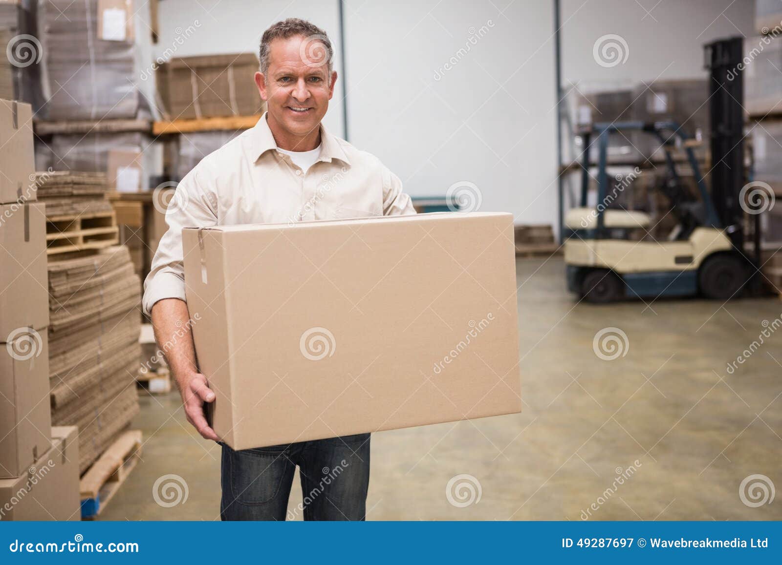 Smiling Worker Carrying a Box Stock Image - Image of happy, industrial ...