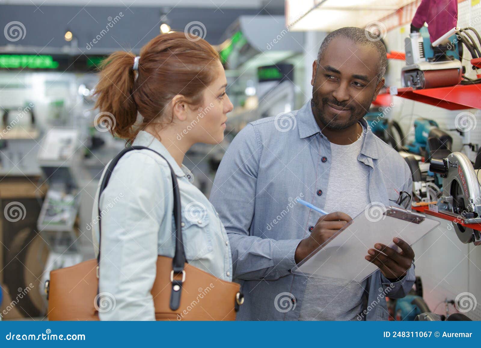 Smiling Worker with Clipboard Talking To Customer Stock Image - Image ...