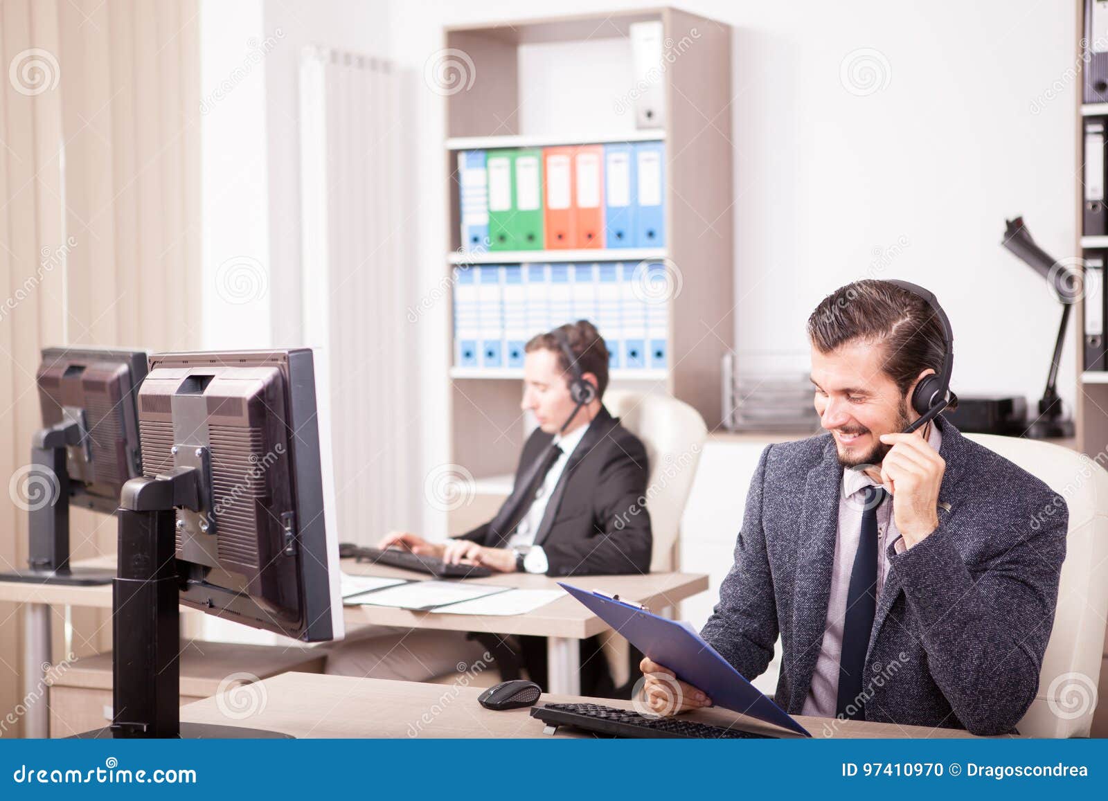 Smiling Worker from Customer Service Support in the Office Stock Photo ...