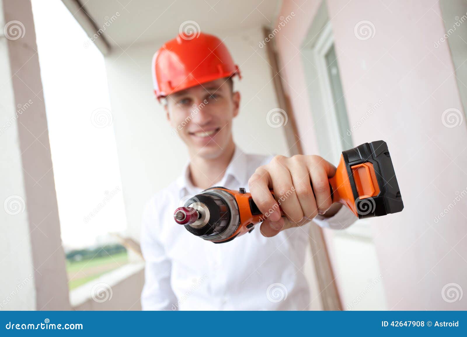 Smiling worker with drill stock photo. Image of craftsman - 42647908