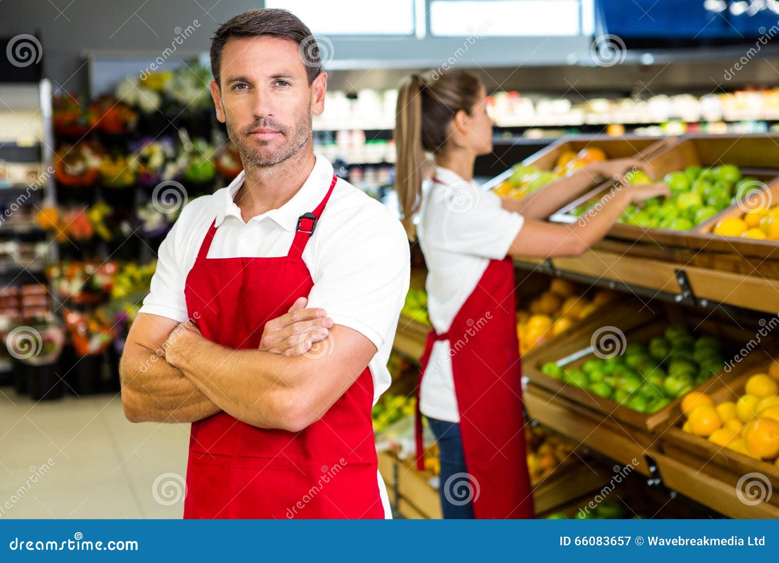 Smiling Worker in Front of Colleague Stock Image - Image of serious ...