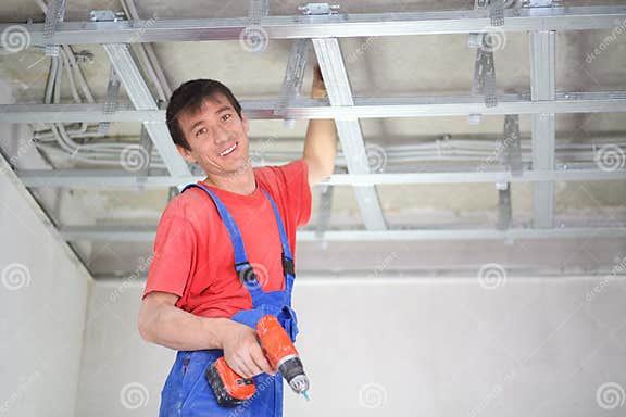 Smiling Worker is Installing a Ceiling Profile for Stock Photo - Image ...