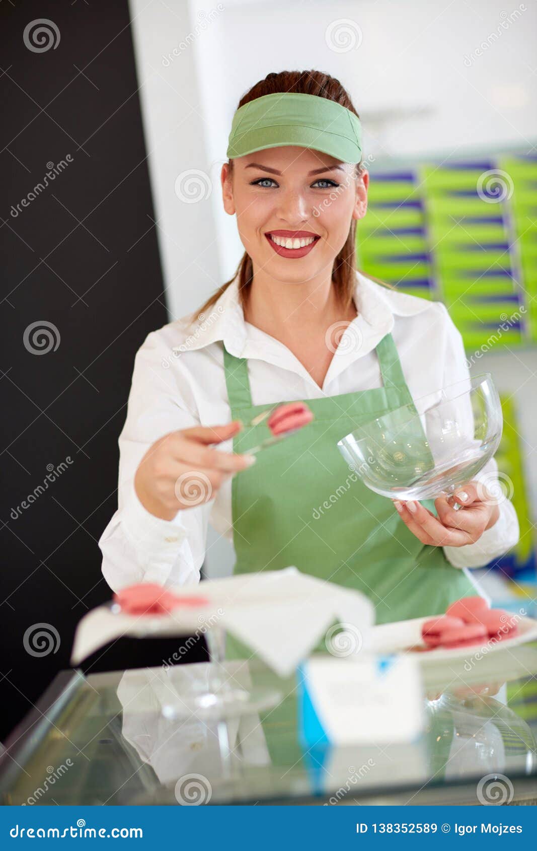 Smiling Worker in Pastry Shop Taking Macarons Stock Image - Image of ...