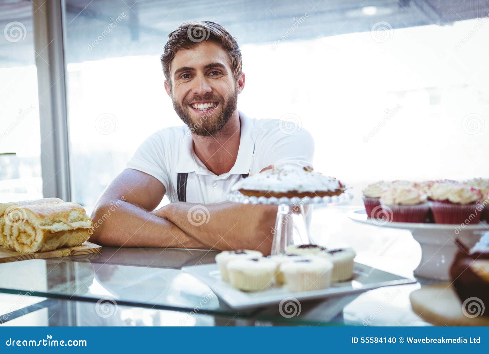 Smiling Worker Posing Behind the Counter Arm Crossed Stock Photo ...