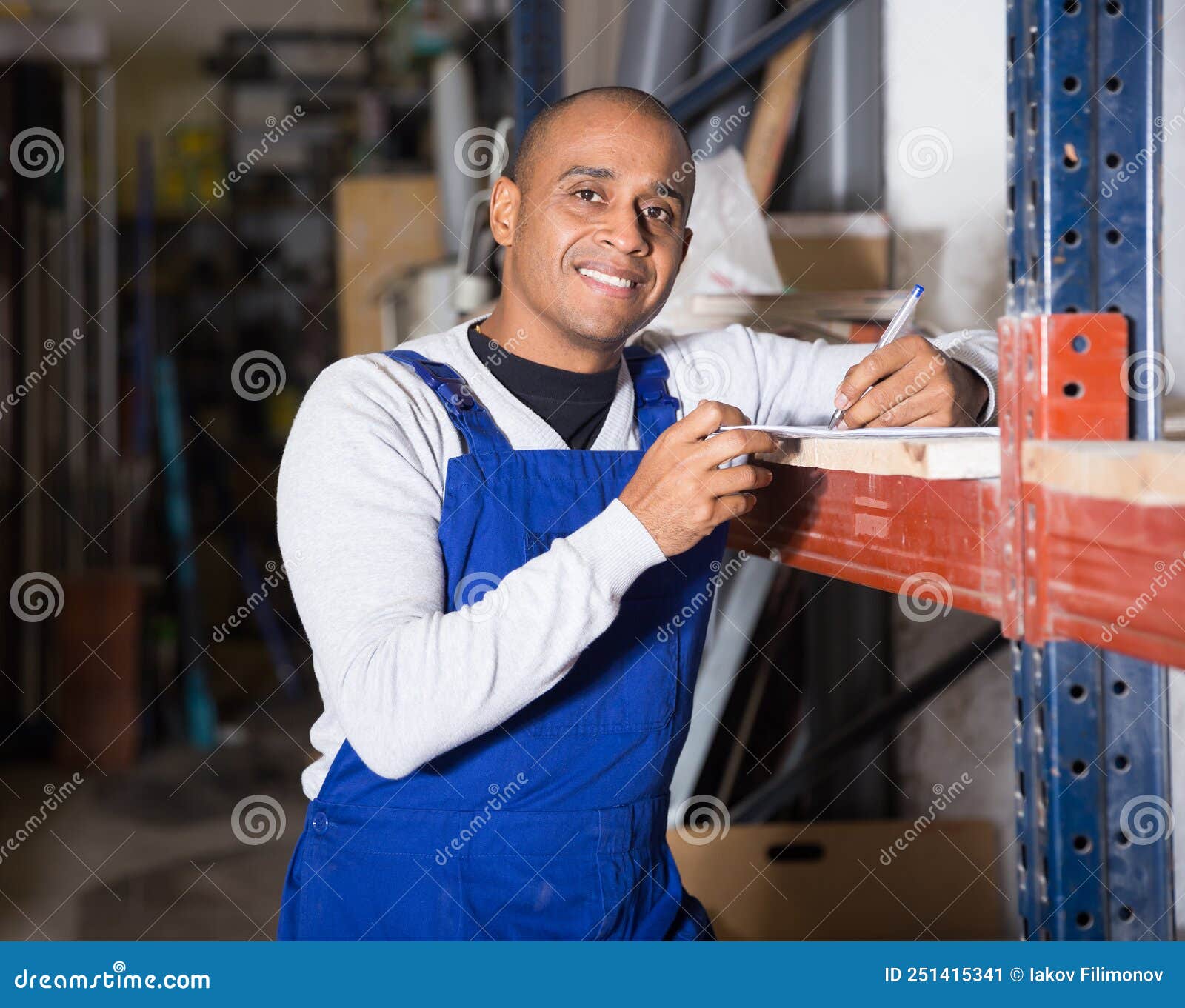 Smiling Worker Taking Notes during Inventory in Hardware Store Stock ...