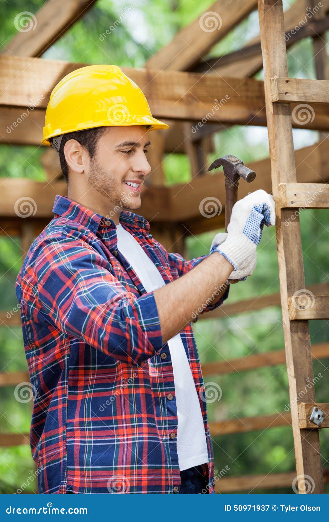 Smiling Worker Using Hammer in Wooden Cabin Stock Image - Image of ...