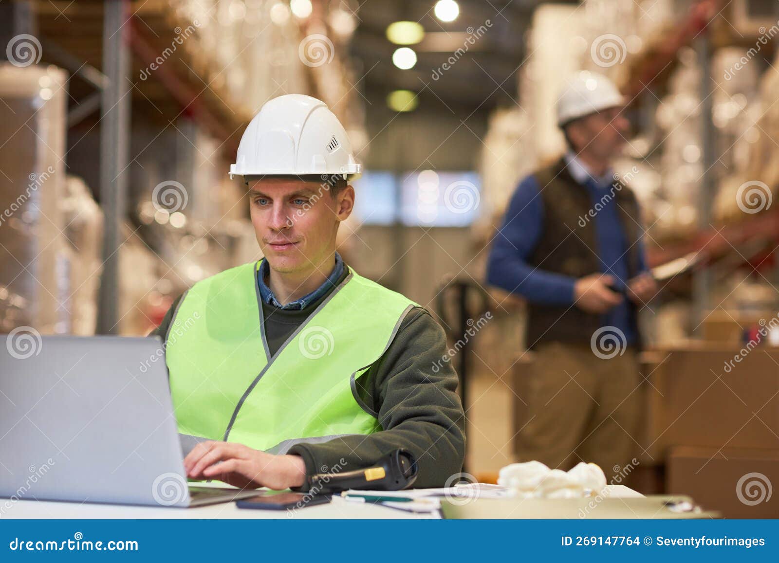 Smiling Worker Using Laptop in Warehouse Managing Distribution System ...
