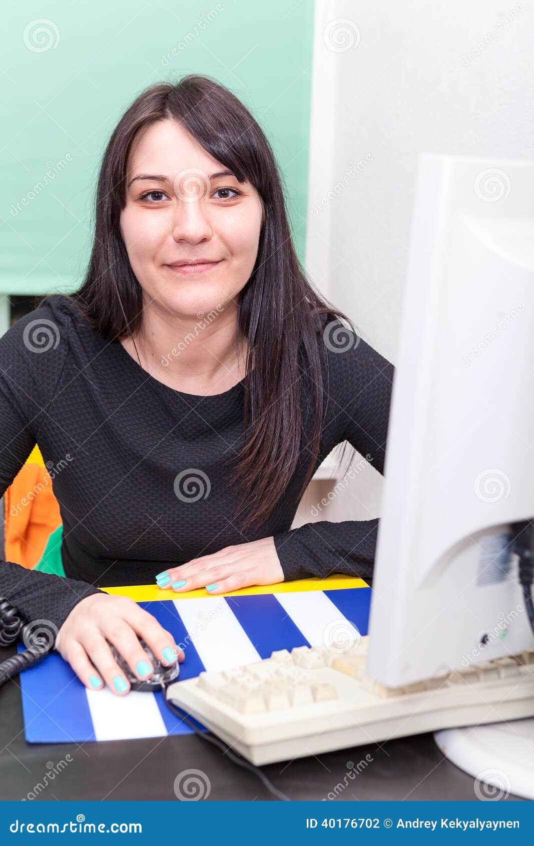 Smiling Working Woman Behind Computer Monitor Stock Photo - Image of ...