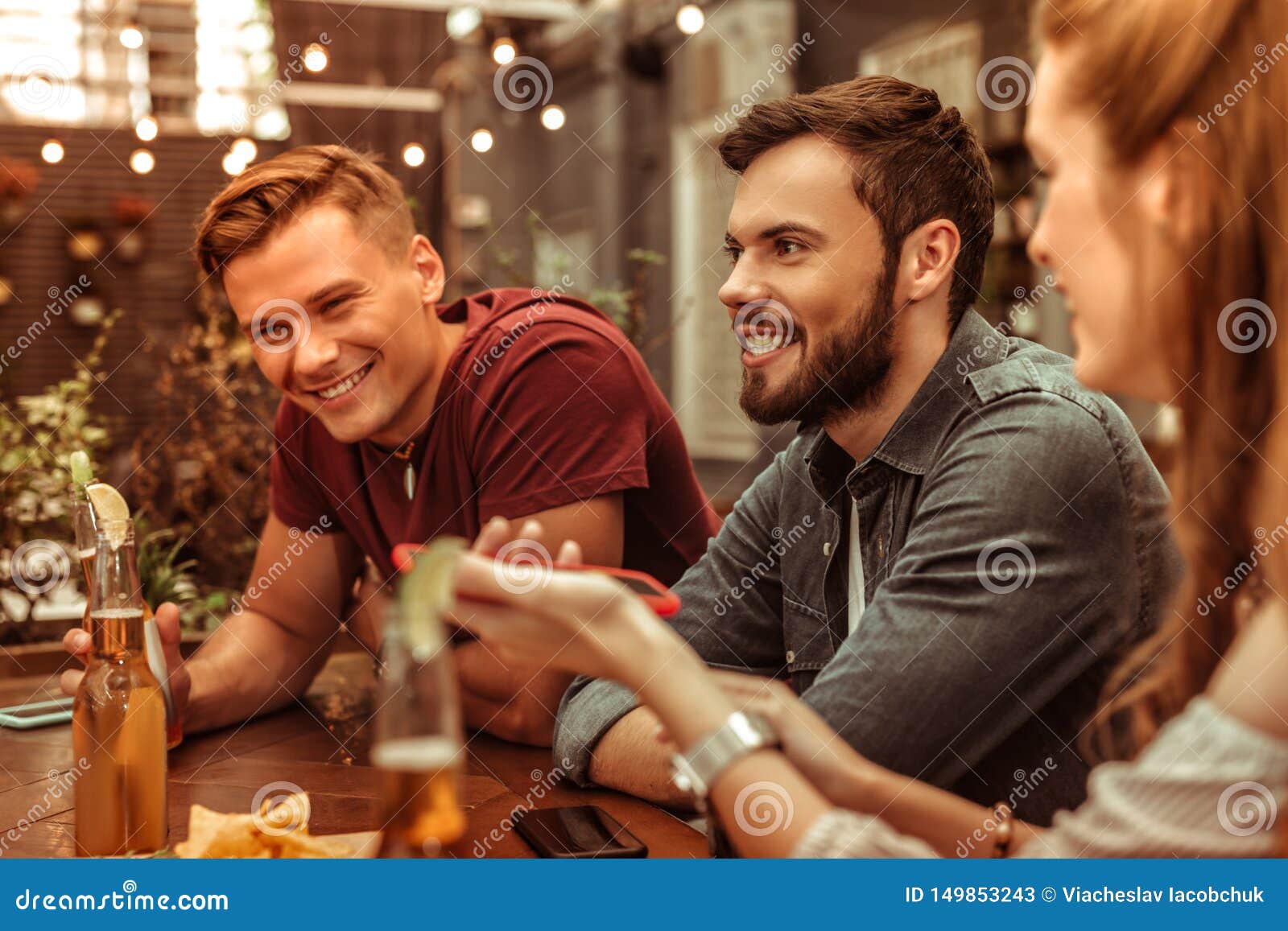 Smiling Young-adult Two Men Sitting at the Bar Table Stock Image ... Smiling Young-adult Two Men Sitting at the Bar Table Stock Image ...