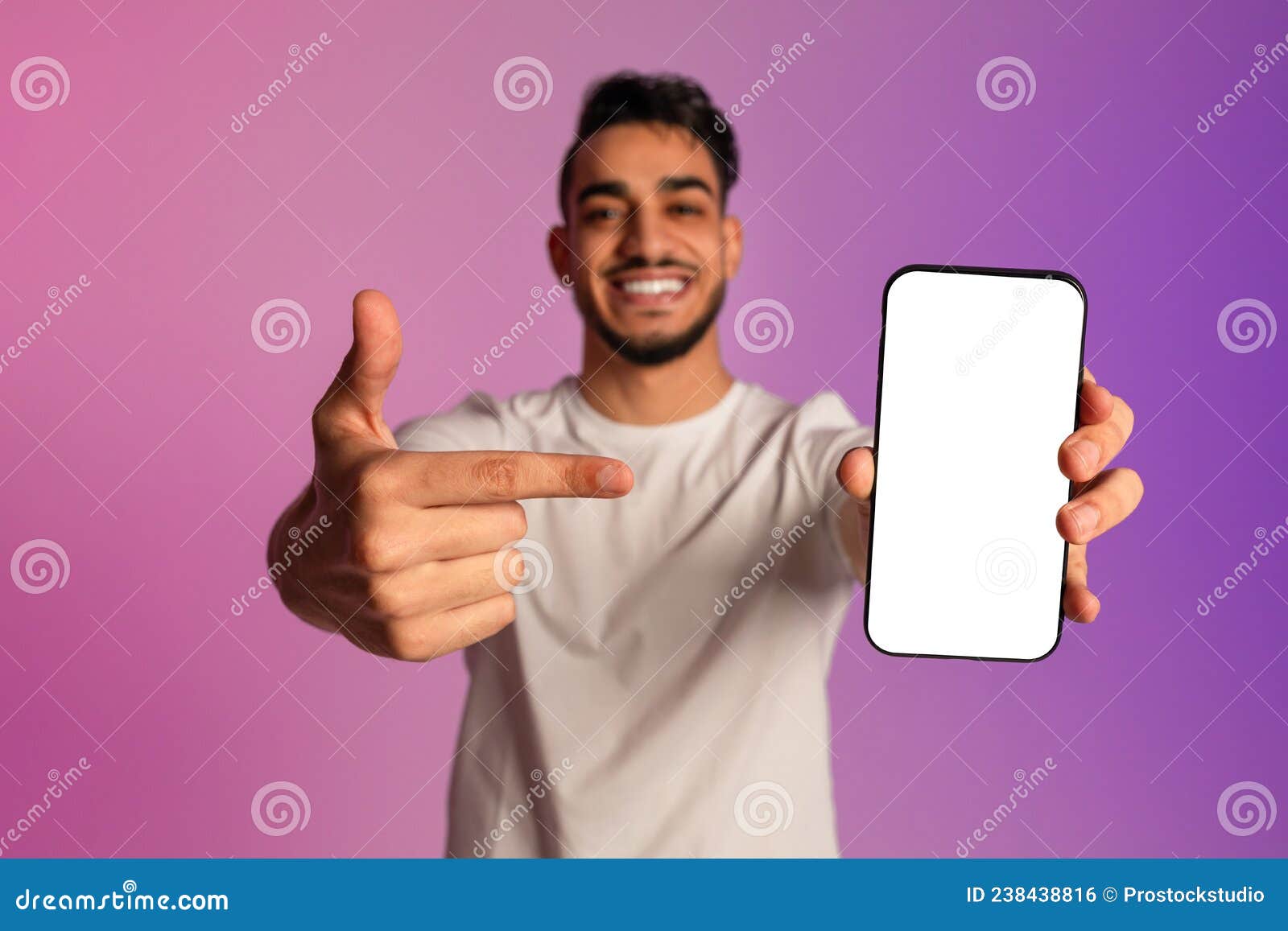 Smiling Young Arab Guy Pointing at Cellphone with Mockup for Mobile App ...