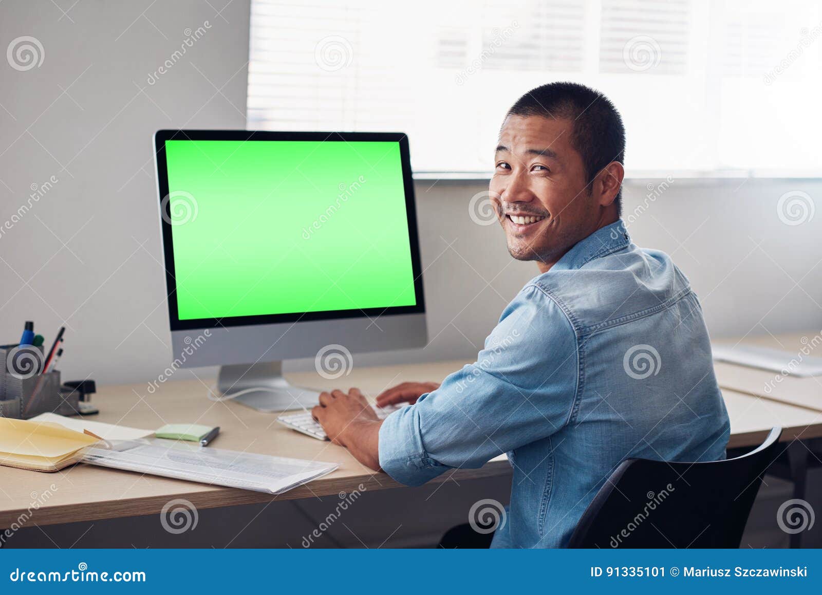Smiling Young Asian Designer at Work on an Office Computer Stock Image ...