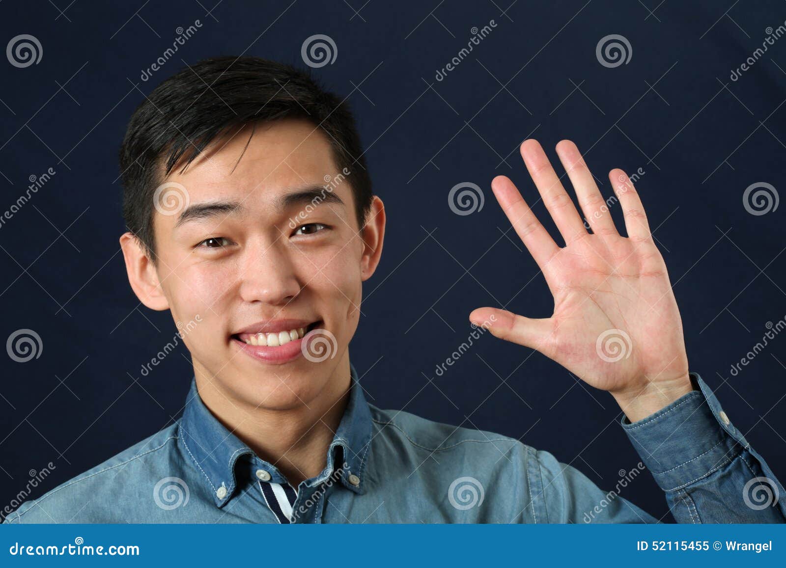 Smiling Young Asian Man Waving His Palm Stock Image - Image of grinning ...
