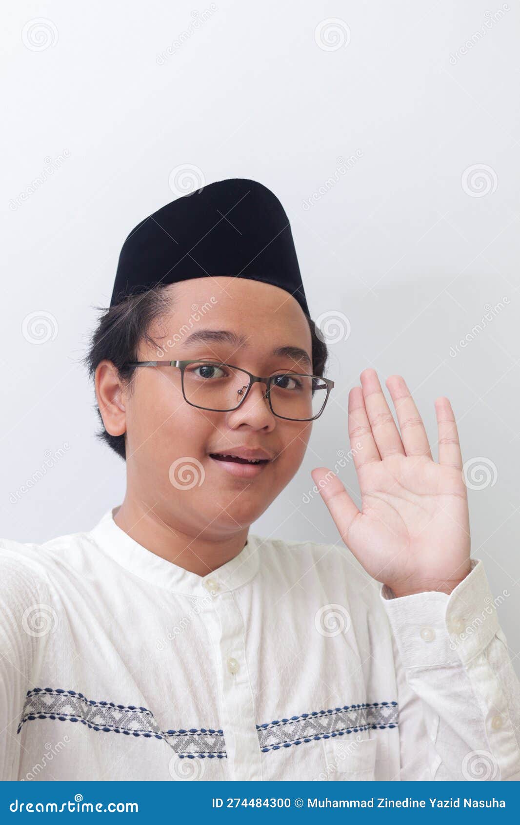 Smiling Young Asian Muslim Man Taking Picture of Himself or Selfie ... Smiling Young Asian Muslim Man Taking Picture of Himself or Selfie ...
