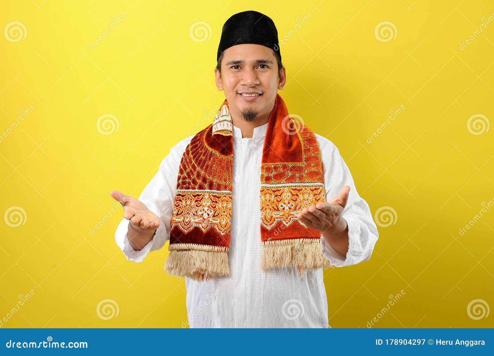 Smiling Young Asian Muslim Man with Welcome Gesture during Ramadan ... Smiling Young Asian Muslim Man with Welcome Gesture during Ramadan ...