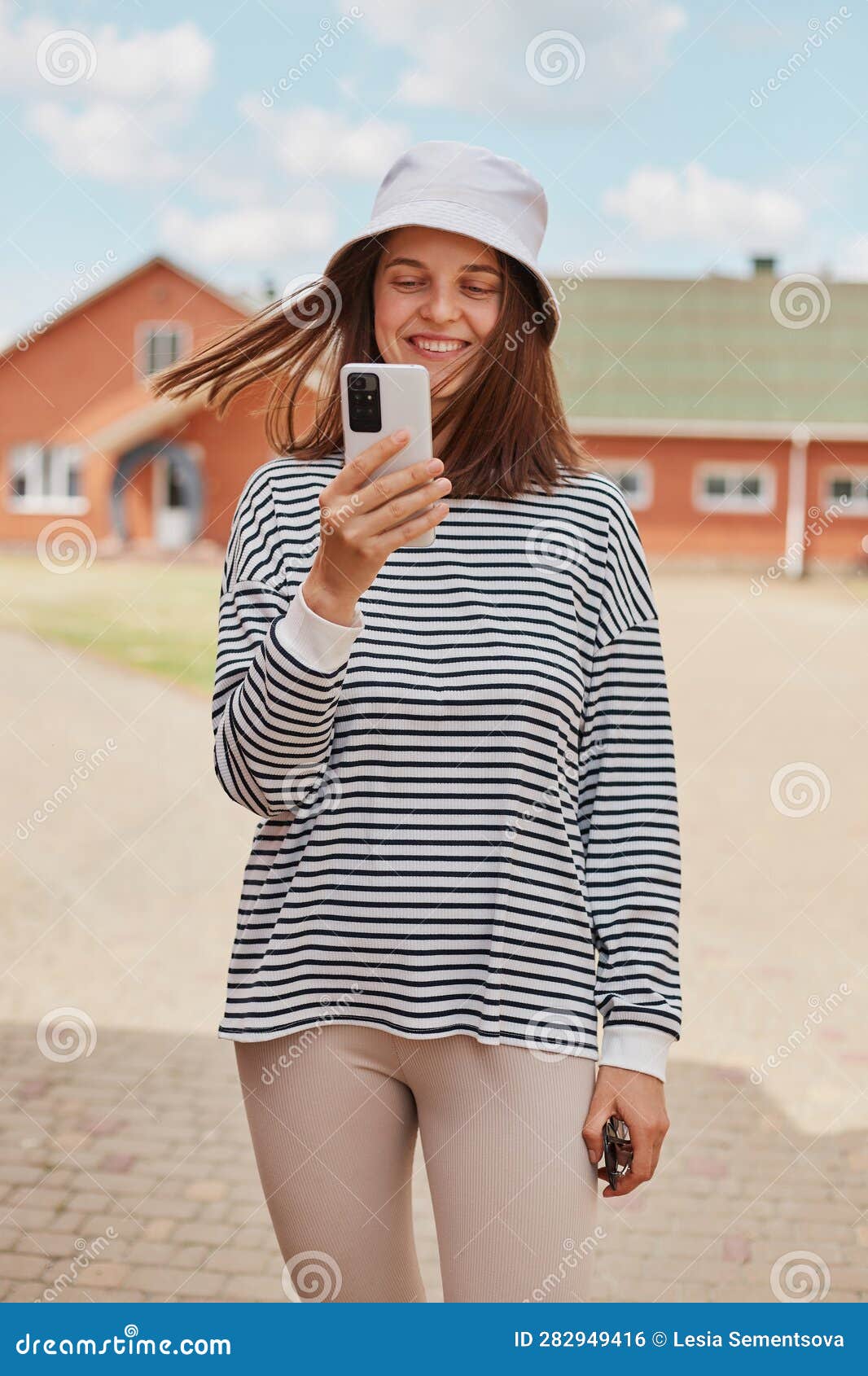Smiling Young Beautiful Caucasian Woman Wearing Striped Shirt And