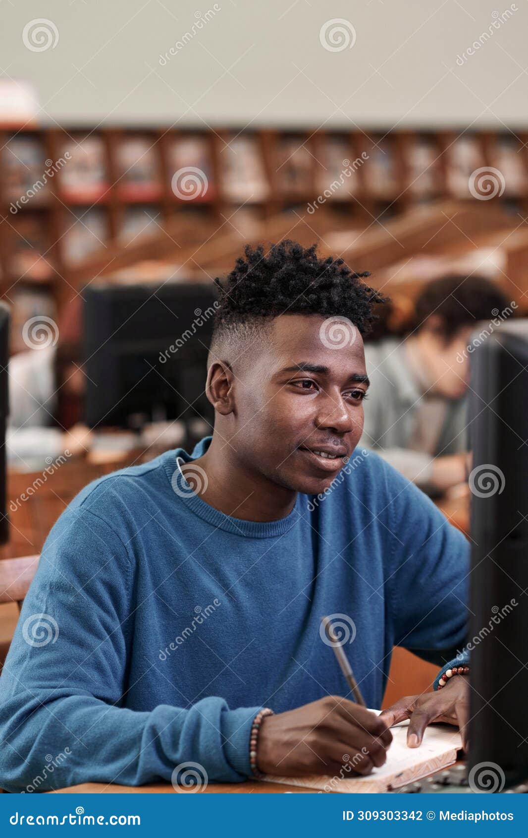 Smiling Young Black Man Looking at Computer Screen Stock Photo - Image ...